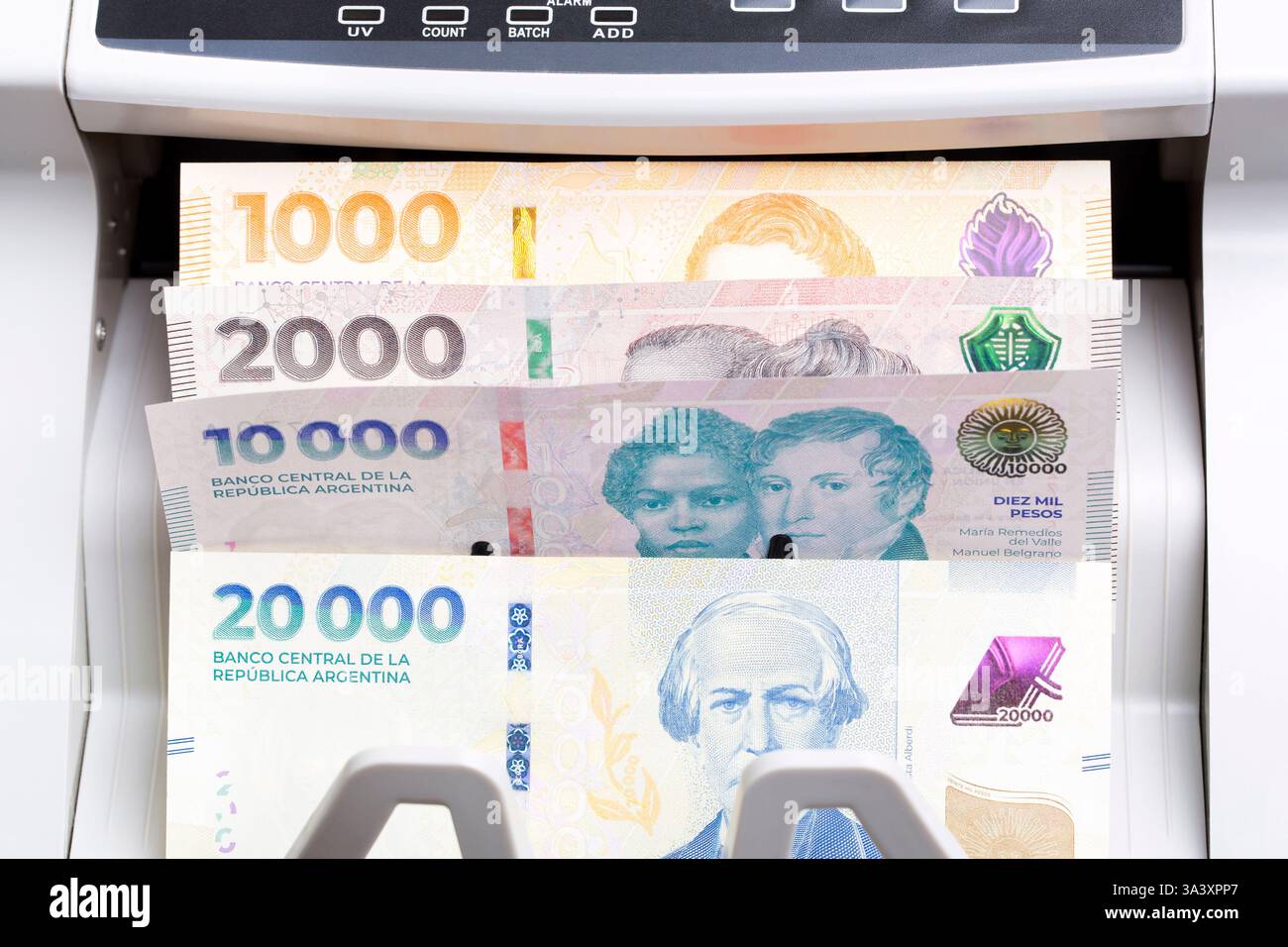 Argentine money - peso in the counting machine Stock Photo - Alamy