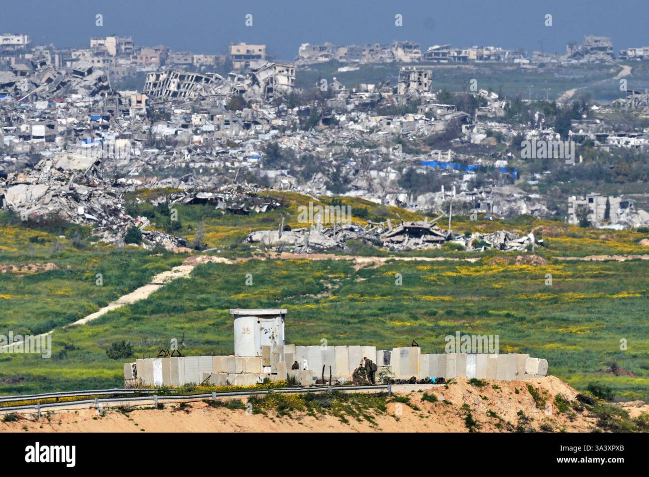 Israeli soldiers gather next to a military post on the border with Gaza ...