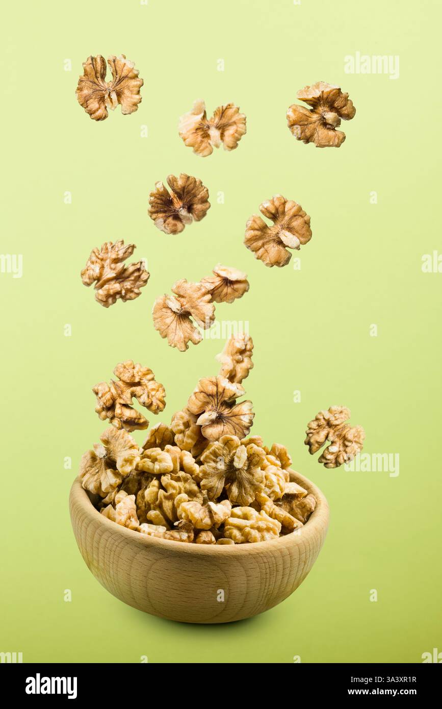 Falling whole walnuts on wooden hi-res stock photography and images - Alamy
