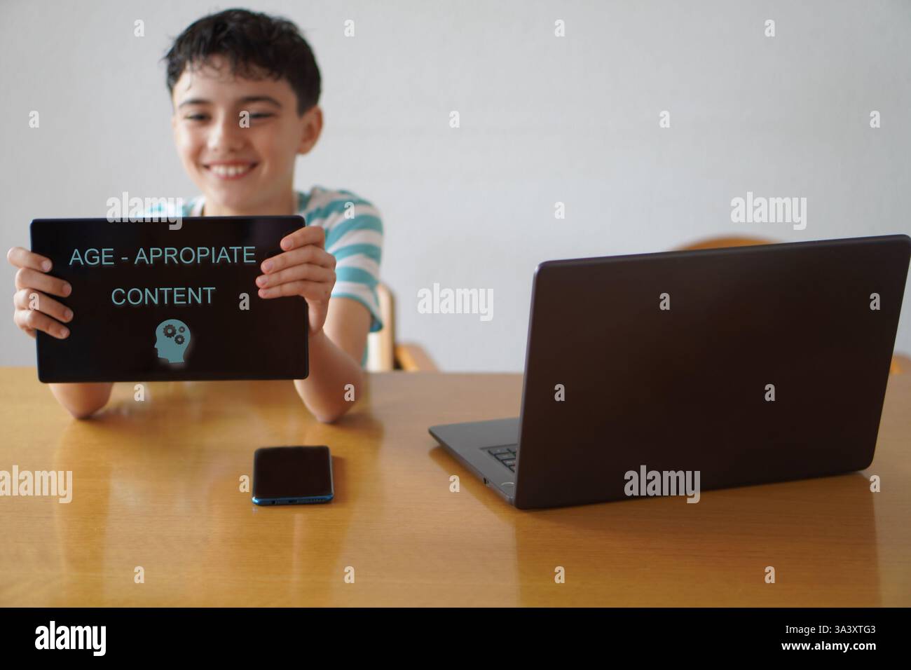 age apropiate content concept. child preteen with mobile laptop and ...