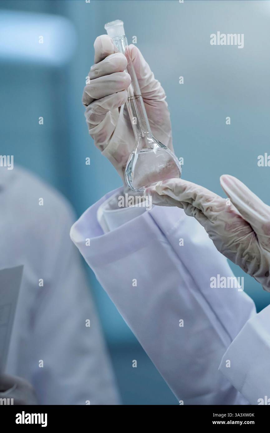 Scientist checking quality of medicine in the modern inspection ...