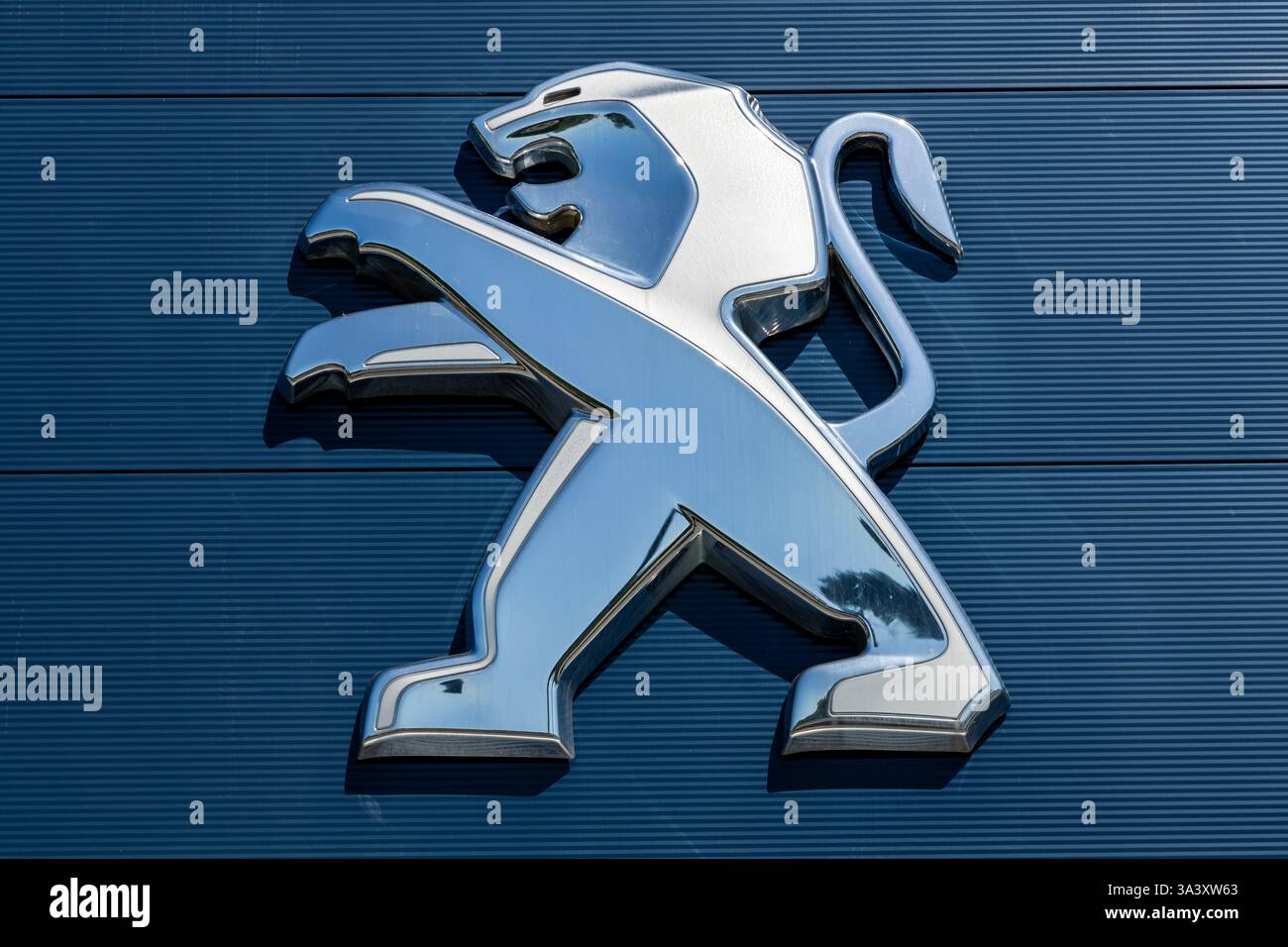 Peugeot chrome logo sign on the building of a car dealer in Montfoort ...