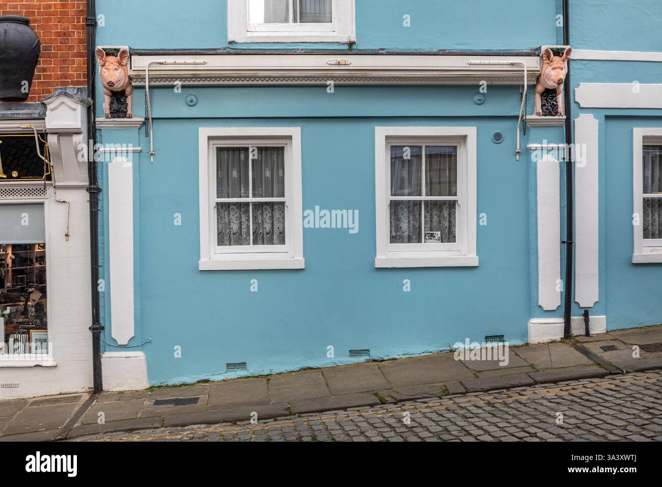 Two plaster pigs heads on the old pork butchers shop in Bayle Street ...