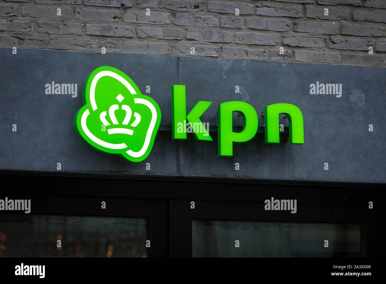 KPN logo at the store front entrance, technology communications company ...