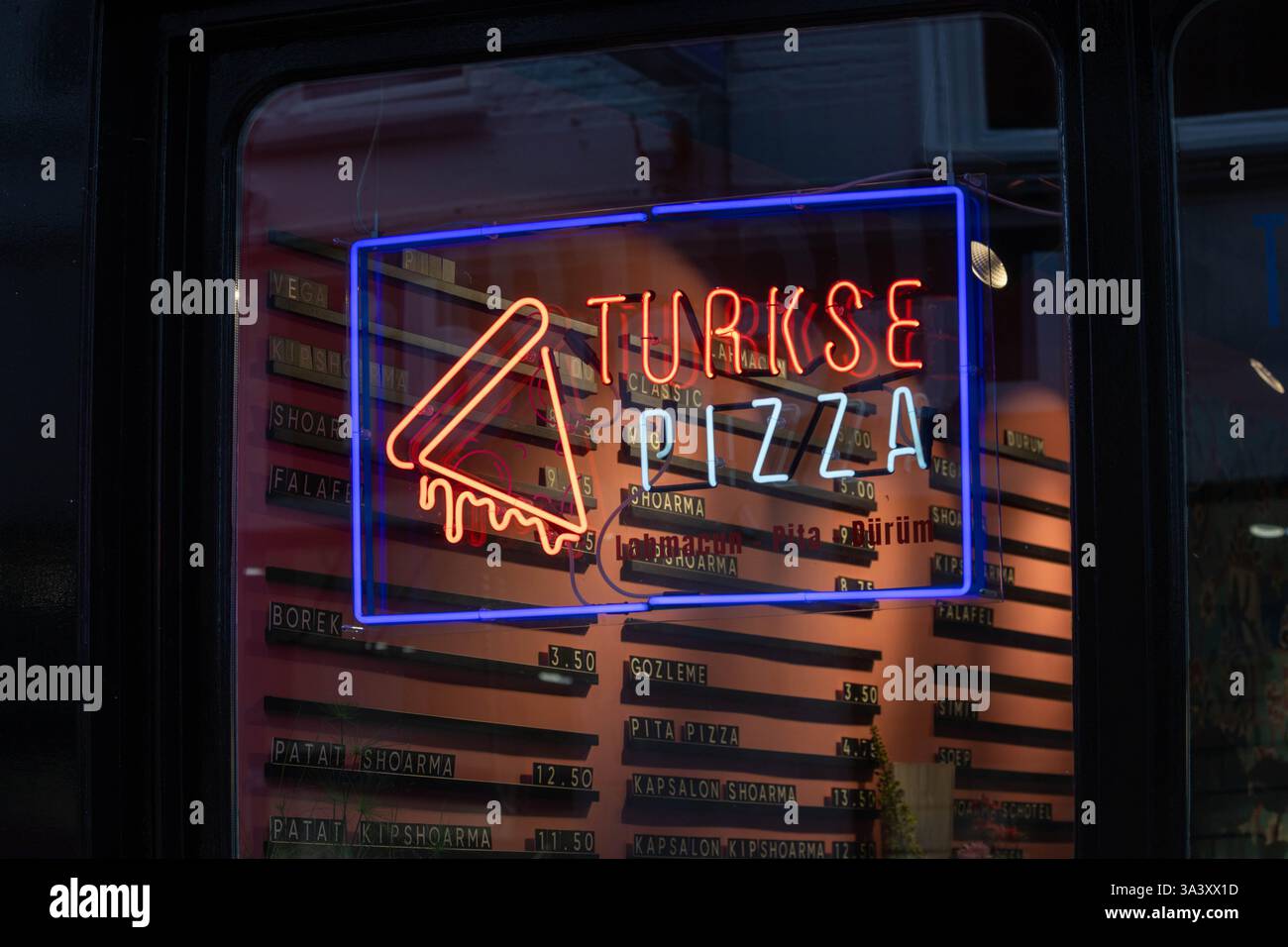 Turkish pizza neon sign in a restaurant in Utrecht, neon sign hanging ...