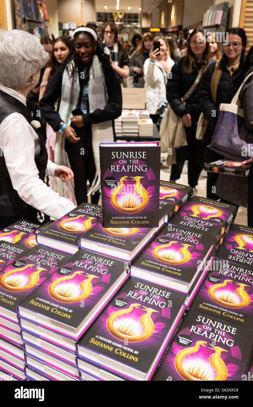 EDITORIAL USE ONLY Fans attend a launch event for the new Hunger Games novel, Sunrise on the ...