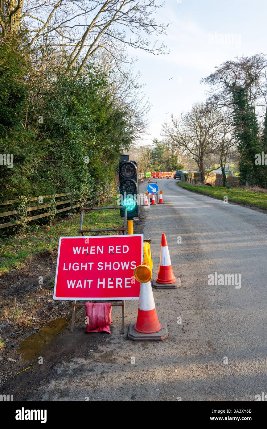 Temporary traffic lights controlling traffic over damaged stone built ...