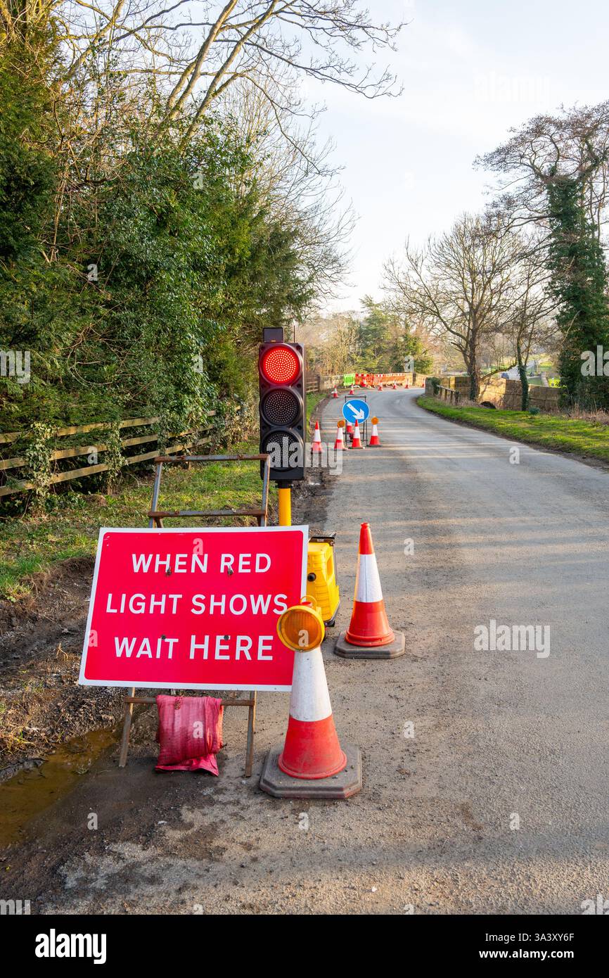 Temporary traffic lights controlling traffic over damaged stone built ...
