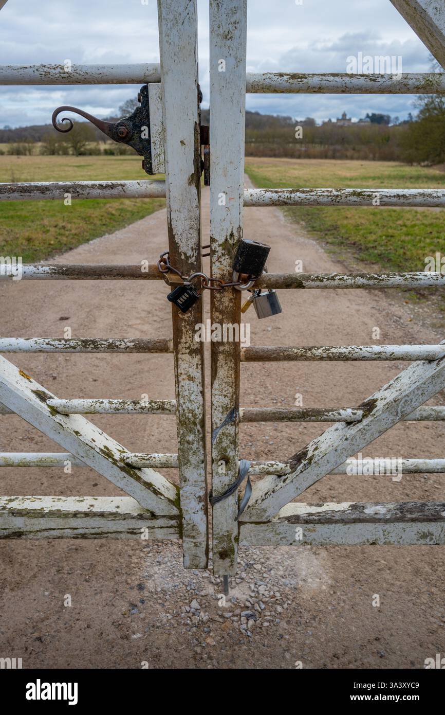 Multiple padlocked wooden gate to the castle Howard country estate ...