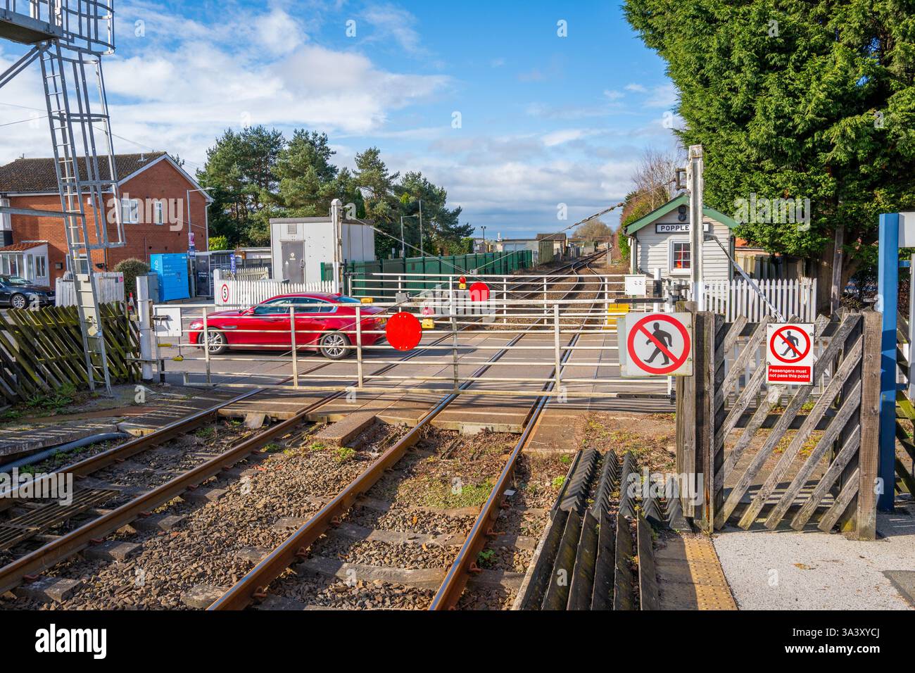 Manually operated level crossing gates at Popperton railway station ...