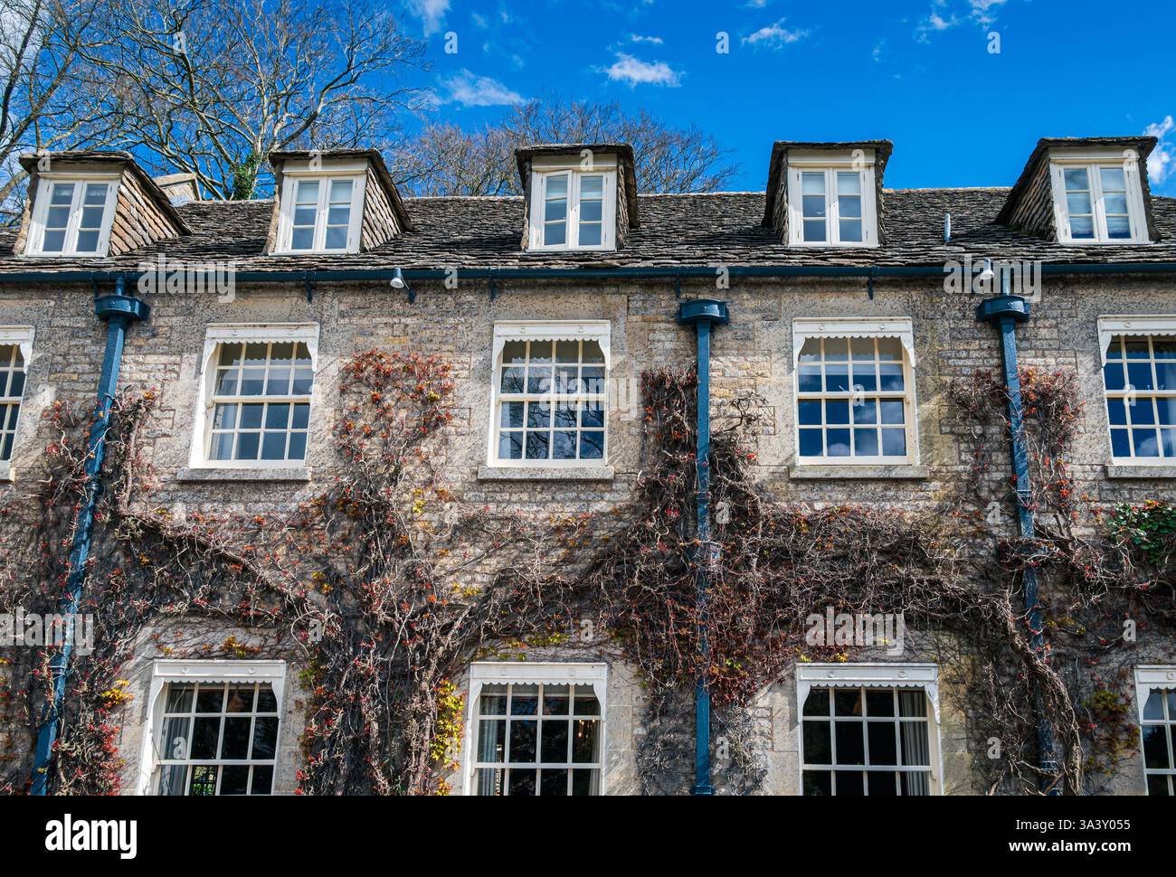 Old village terraced buildings with charming windows and attic frames ...
