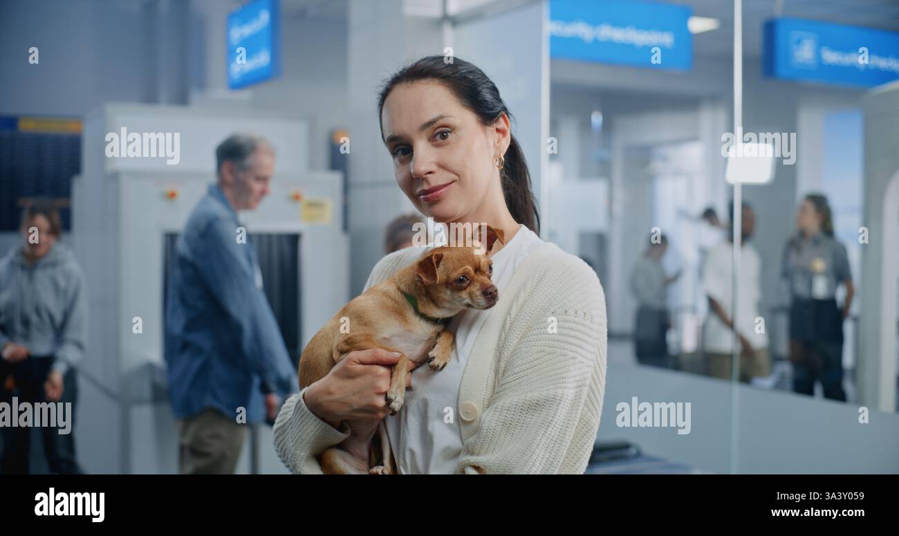 Airport Terminal: Portrait of Happy Woman with Dog Smiling, Looking at ...