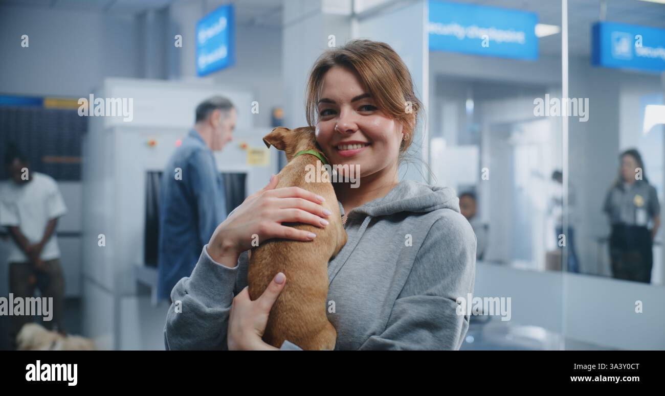 Airport Terminal: Portrait of Happy Woman Holding Her Dog, Smiling ...