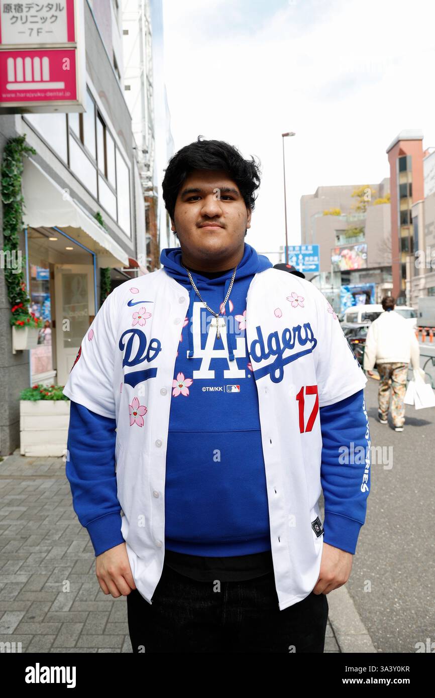Tokyo, Japan. 18th Mar, 2025. A baseball fan wearing the Dodgers jersey ...