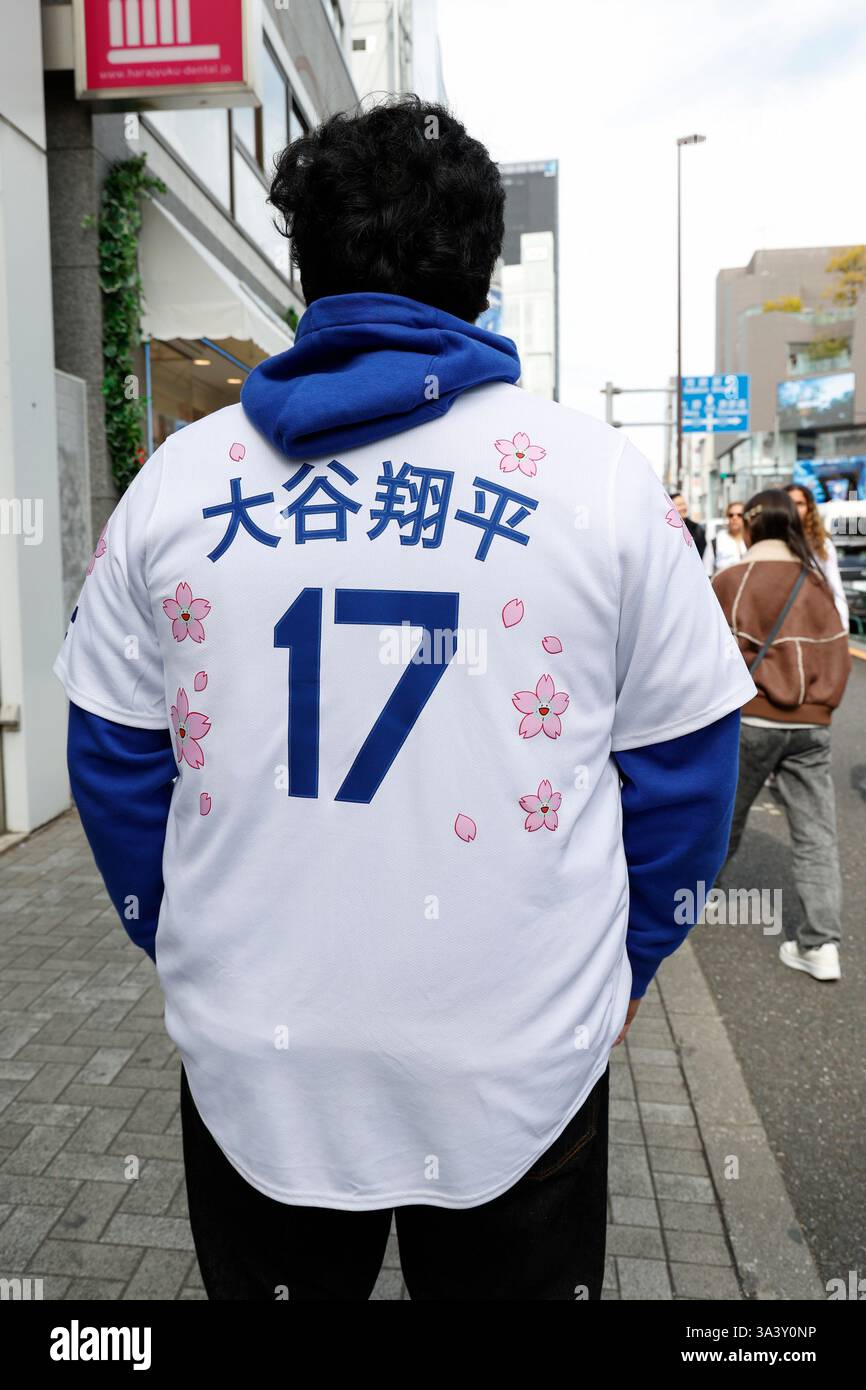 Tokyo, Japan. 18th Mar, 2025. A baseball fan wearing the Dodgers jersey ...
