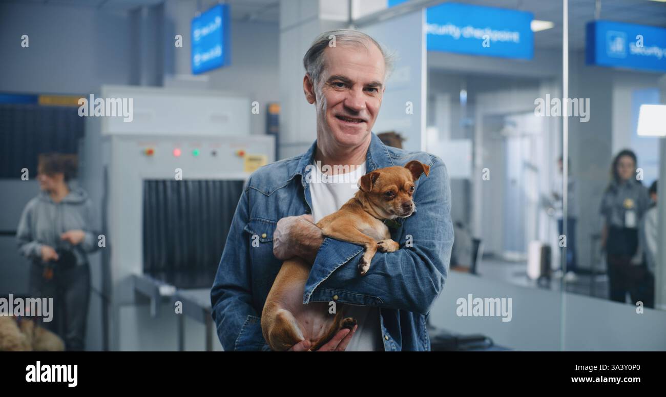 Airport Terminal: Portrait of Mature Man Holding Chihuahua Dog in Hands ...