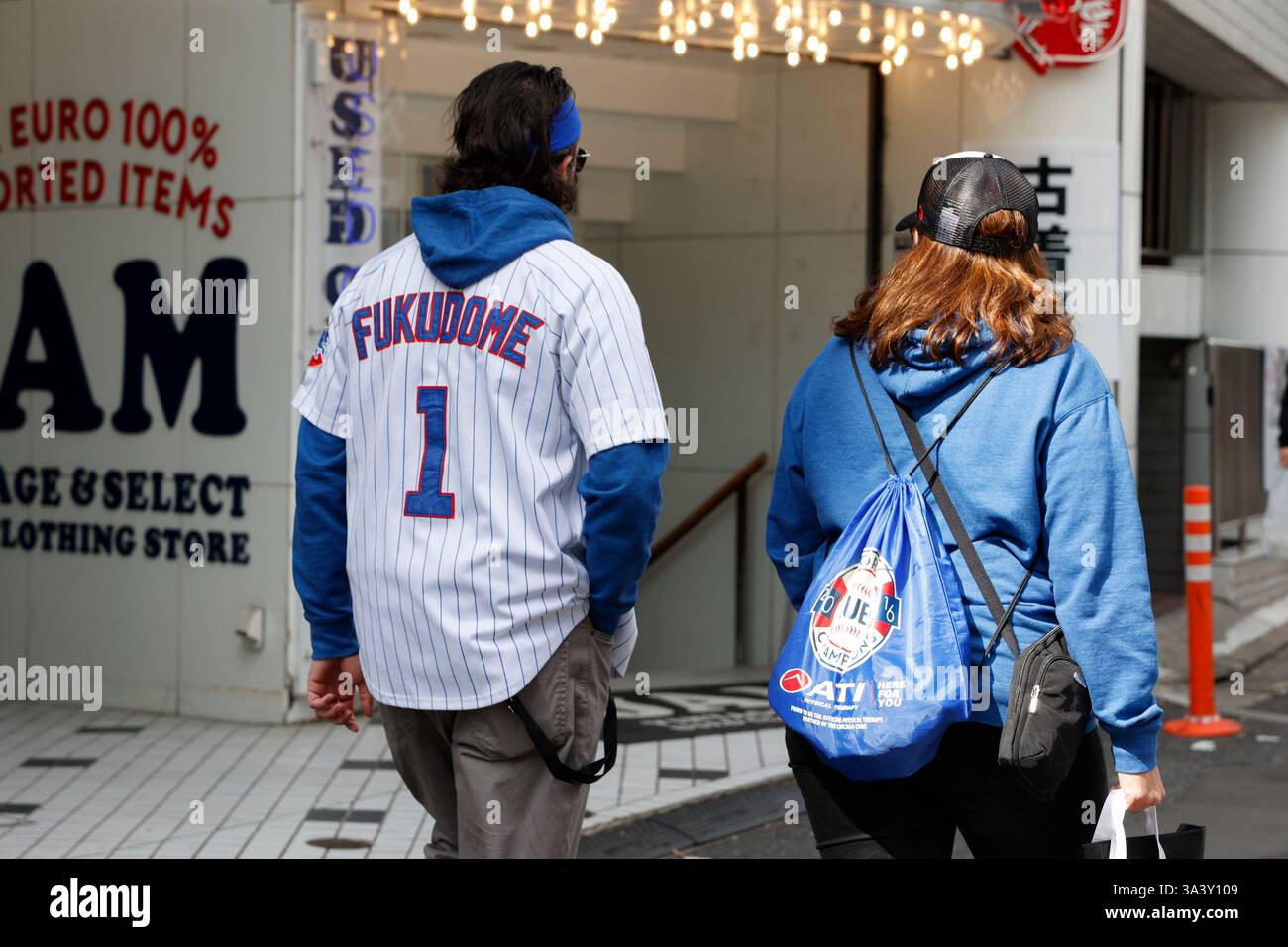 Tokyo, Japan. 18th Mar, 2025. Baseball fans are seen at the shopping ...