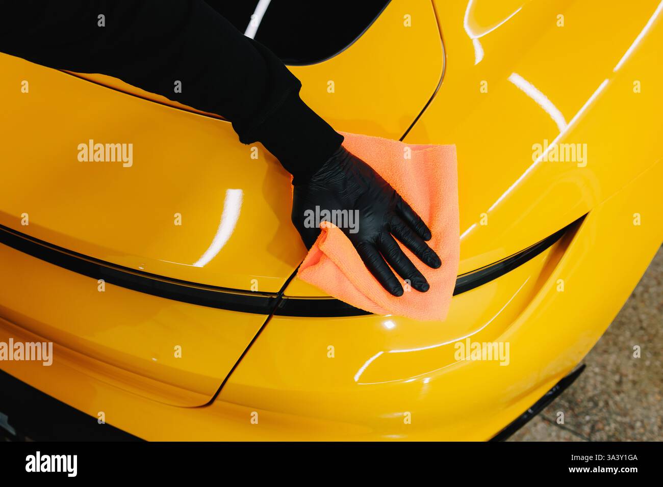 Manual washing and polishing car with microfiber cloth after detailing ...