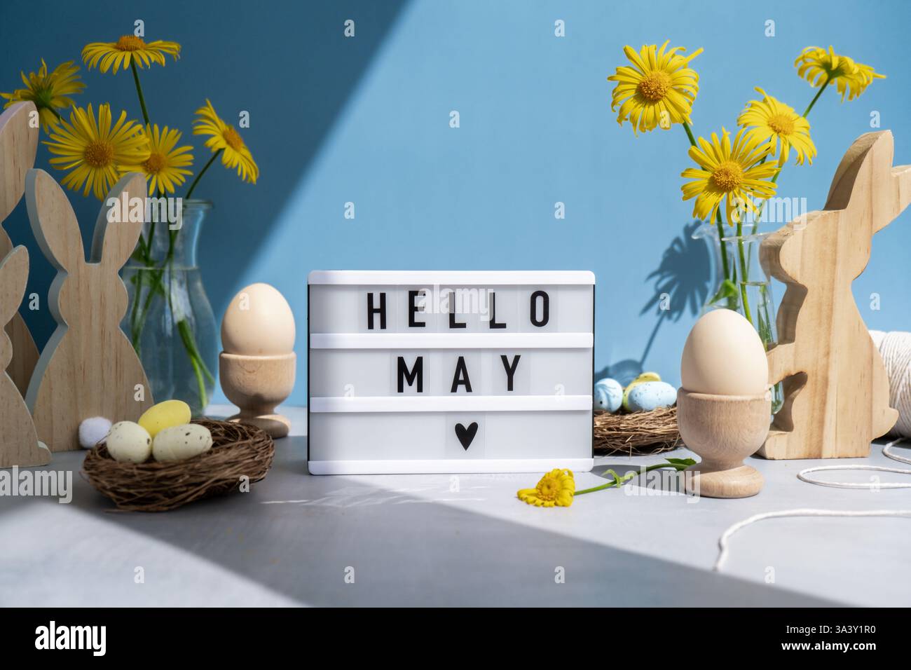 HELLO MAY text on Lightbox with bunny wooden figures eggs and fresh ...