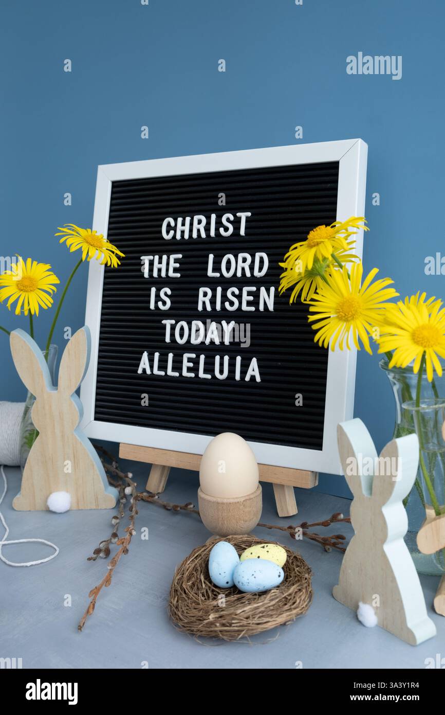 CHRIST THE LORD IS RISEN TODAY ALLELUIA text on letter board with bunny ...