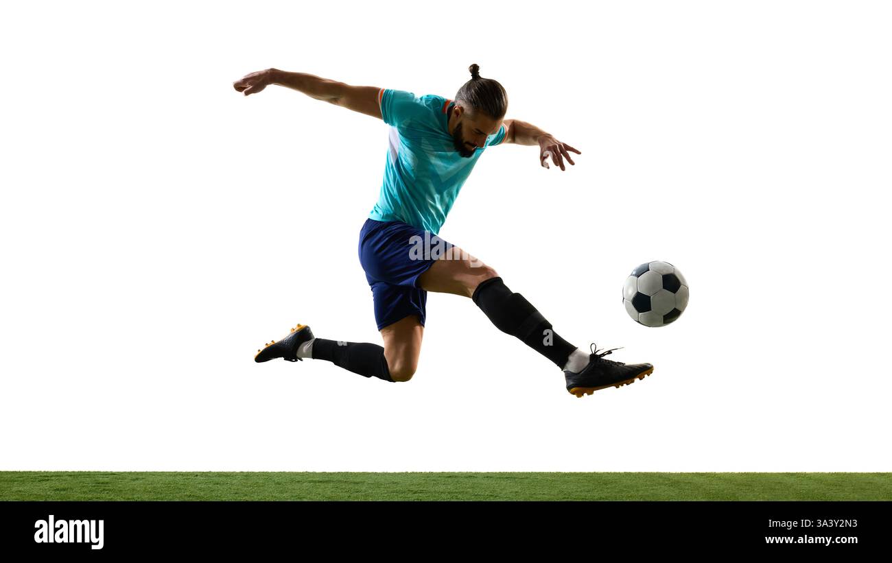 Dynamic photo of young athletic football player leaping in motion and ...