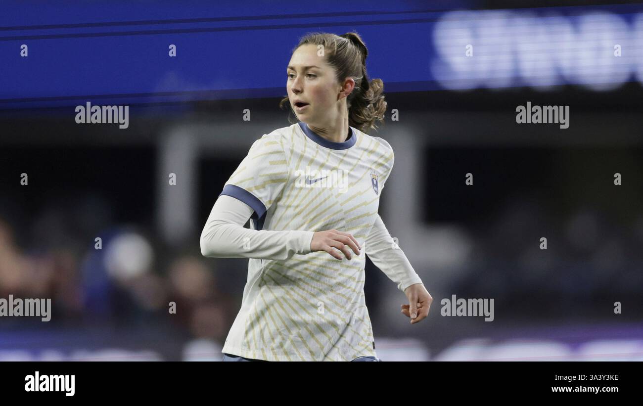Seattle Reign midfielder Maddie Mercado follows the action as she runs ...