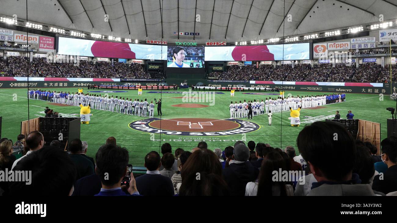 Members of Los Angeles Dodgers and Chicago Cubs sing the U.S. national ...
