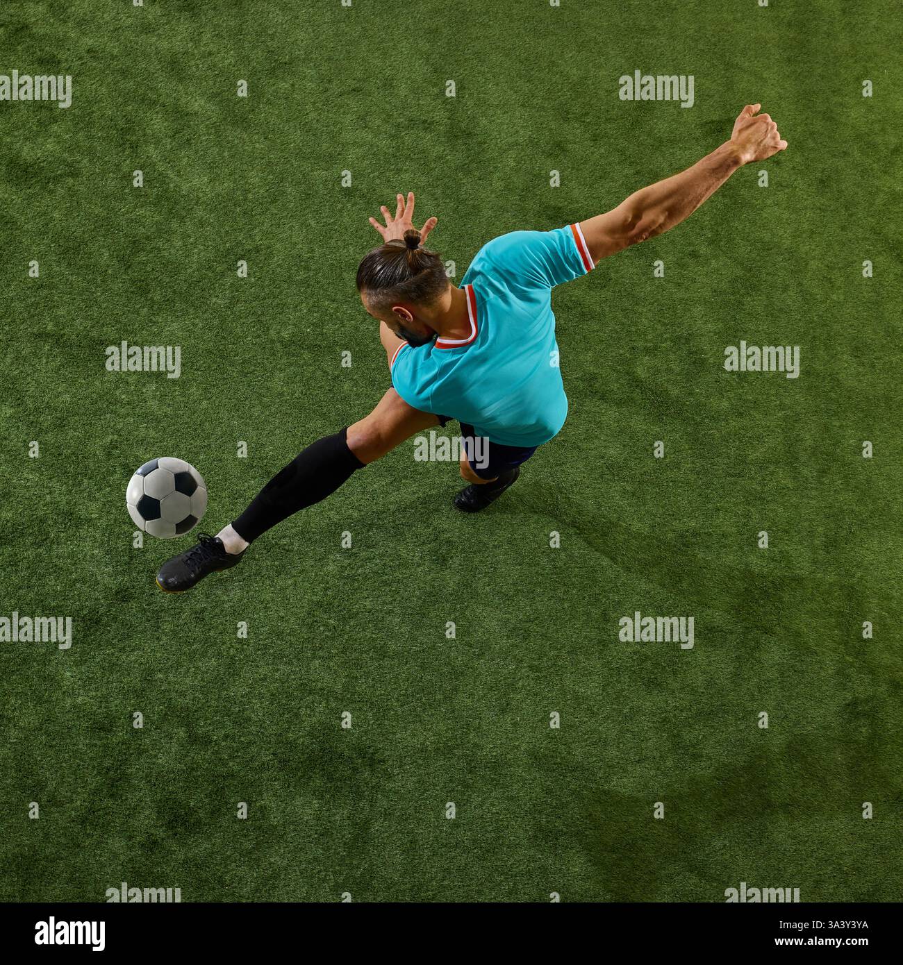 Intense moment of footballer preparing for winning shot, body arched ...