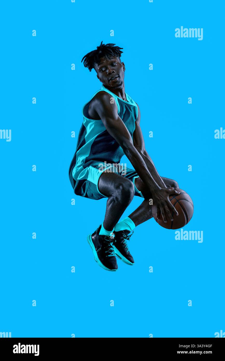 Creative collage. High-flying professional basketball athlete, young ...