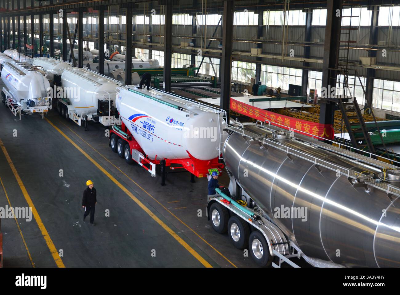FUYANG, CHINA - MARCH 18, 2025 - A worker works at the final assembly ...