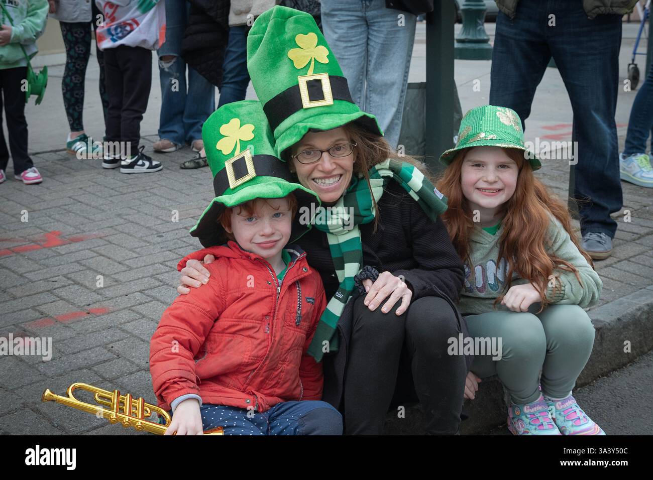 A cheerful family watching the 2025 Peekskill Saint Patrick's Day ...