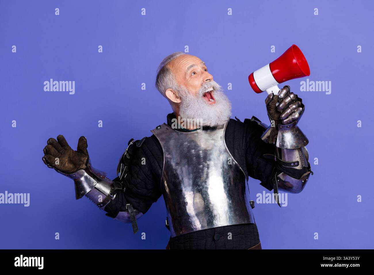 Elderly Knight in Medieval Armor Shouting Through a Red Megaphone on ...