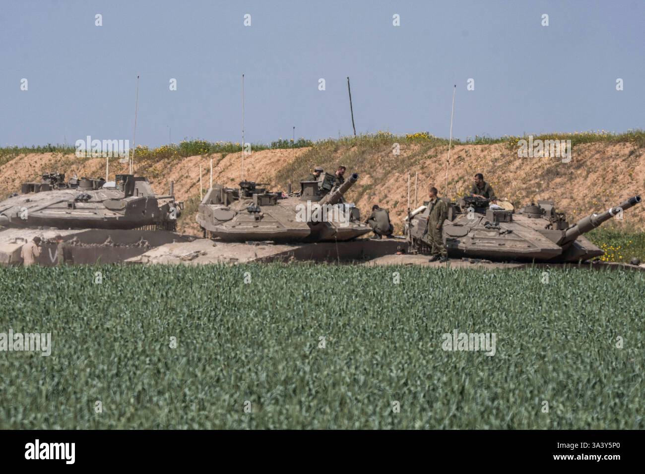18 March 2025, ---: Israeli tanks are seen on the border between Israel ...