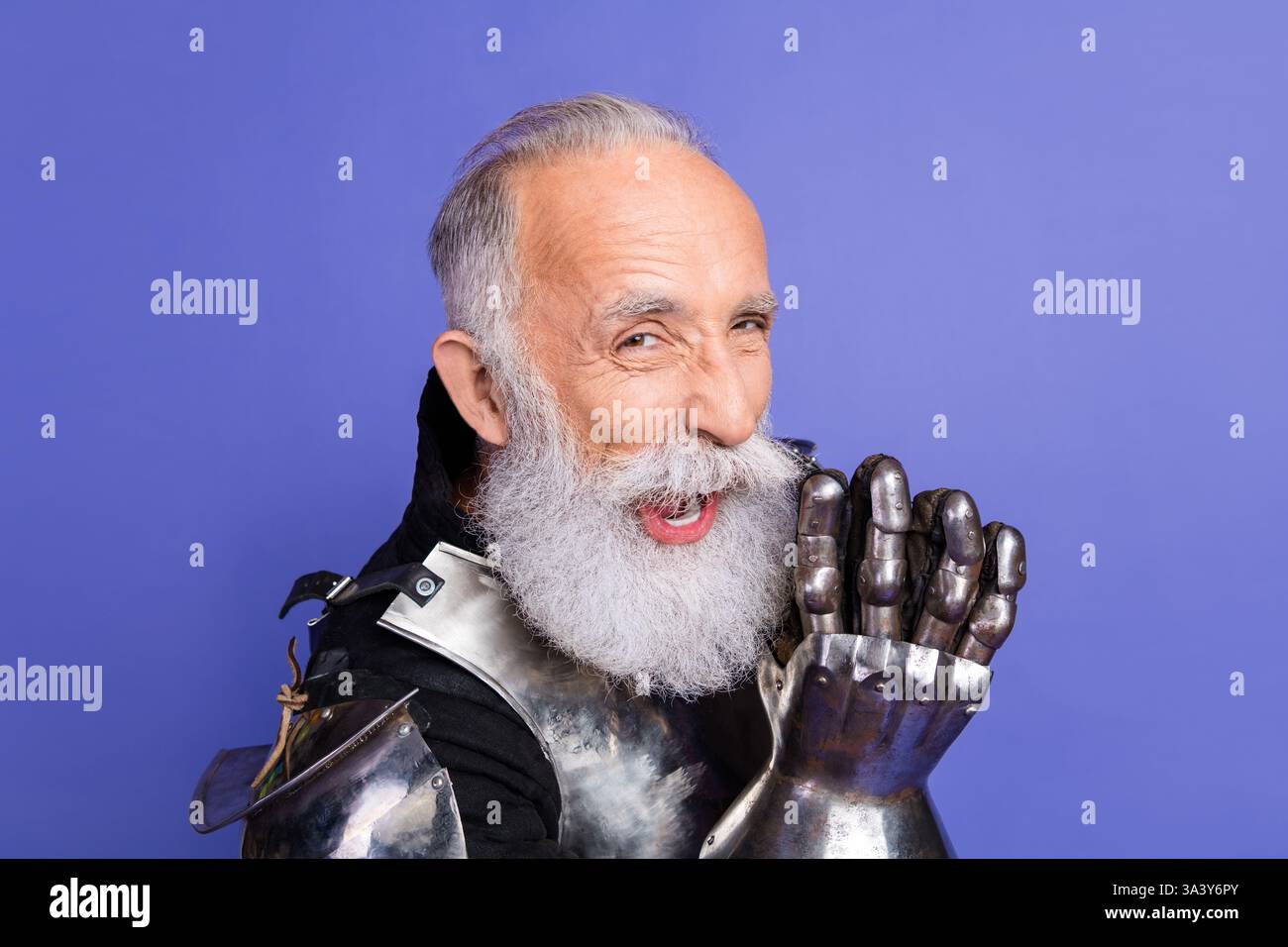 Elderly man dressed as a medieval knight posing with a humorous ...