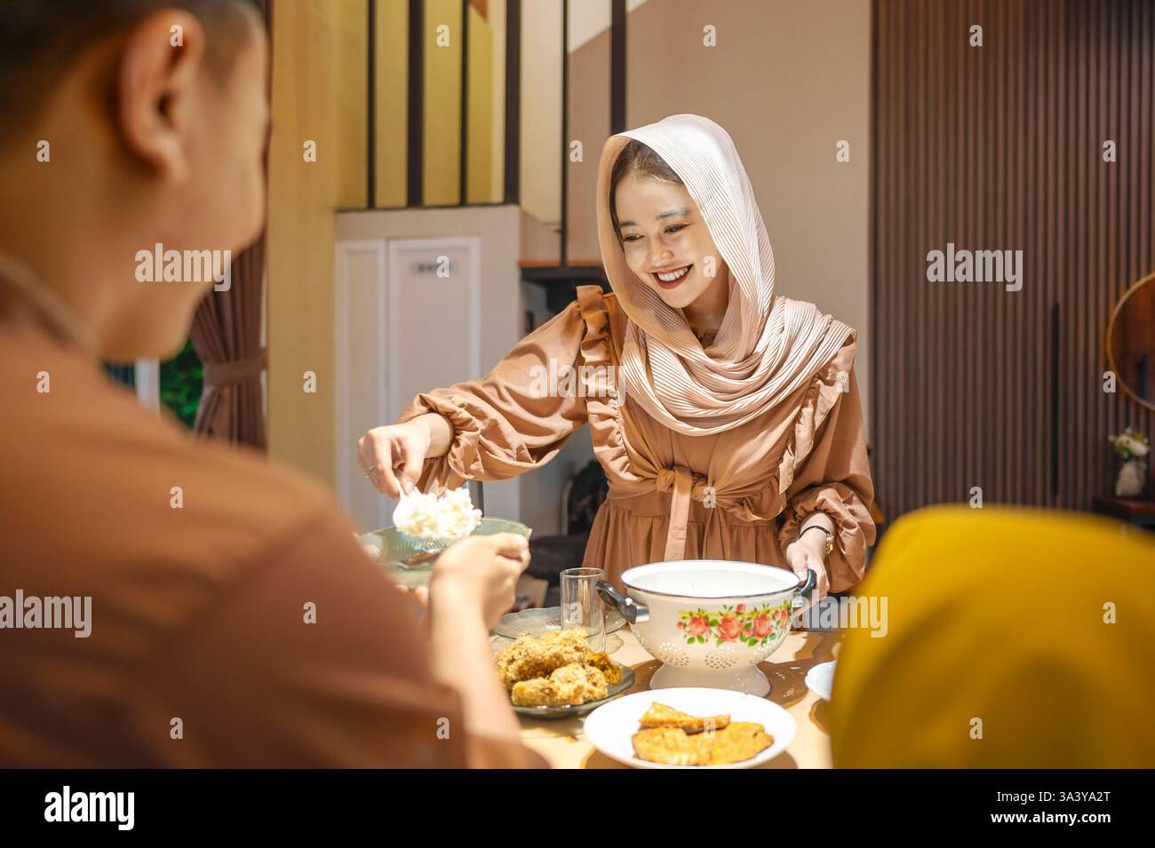 Portrait of Indonesian Muslim mother preparing food for iftar to her ...