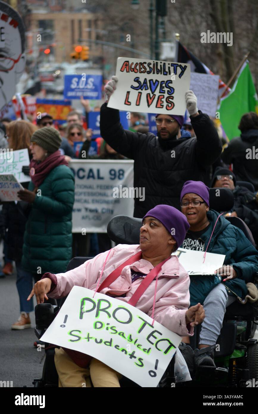 Students in wheelchairs leading a Stop the Cuts march against DOGE in ...