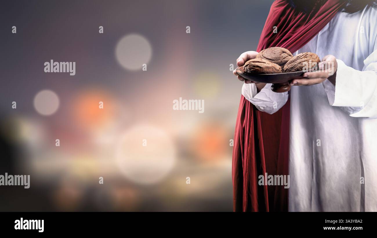 Jesus Christ holding the bread of life to feed the poor. Concept of ...