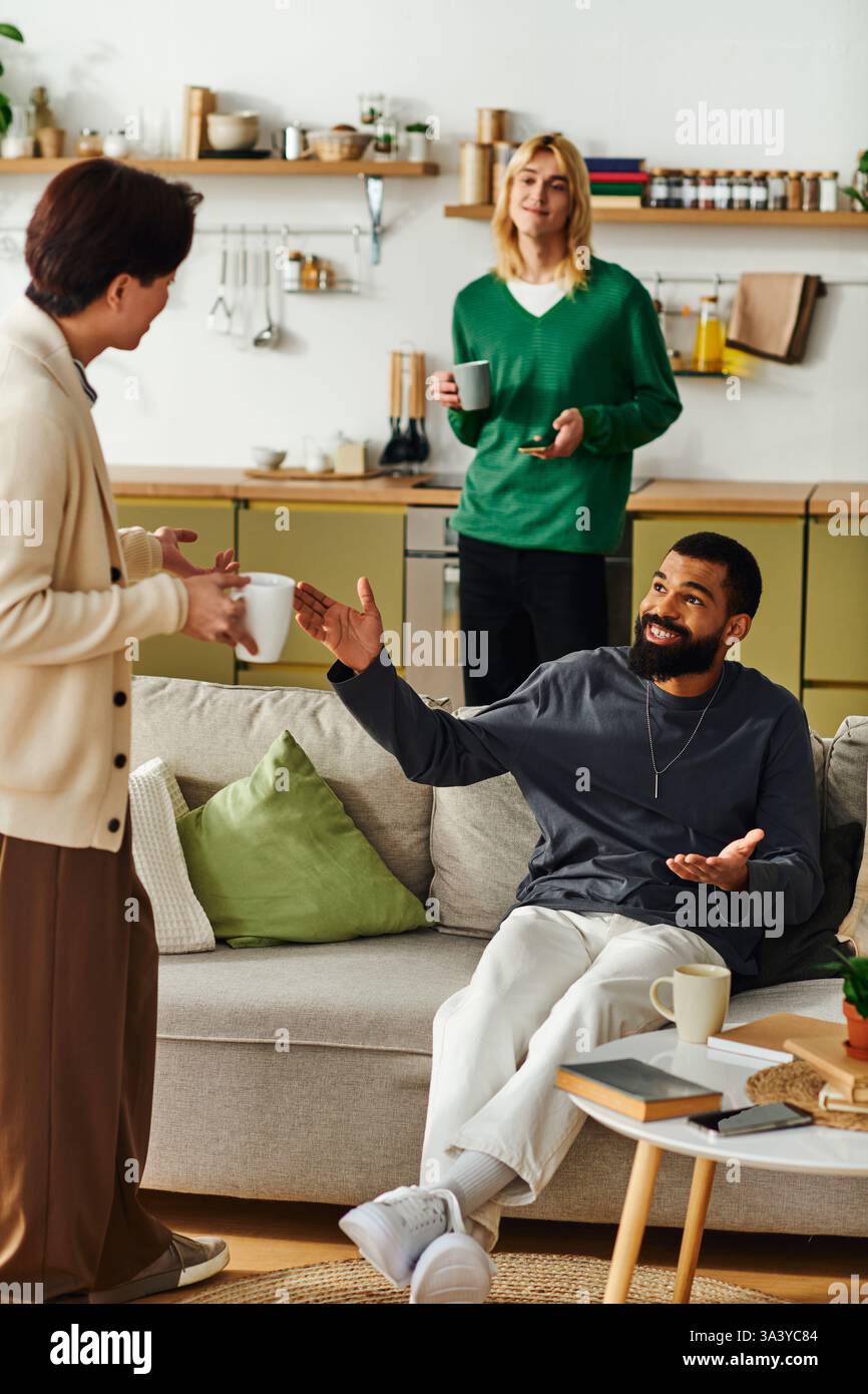 A group of young men enjoy a book club meeting in a stylish living room ...