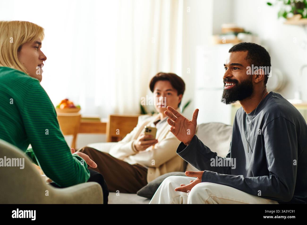 Three young men connect and share ideas during an engaging discussion ...