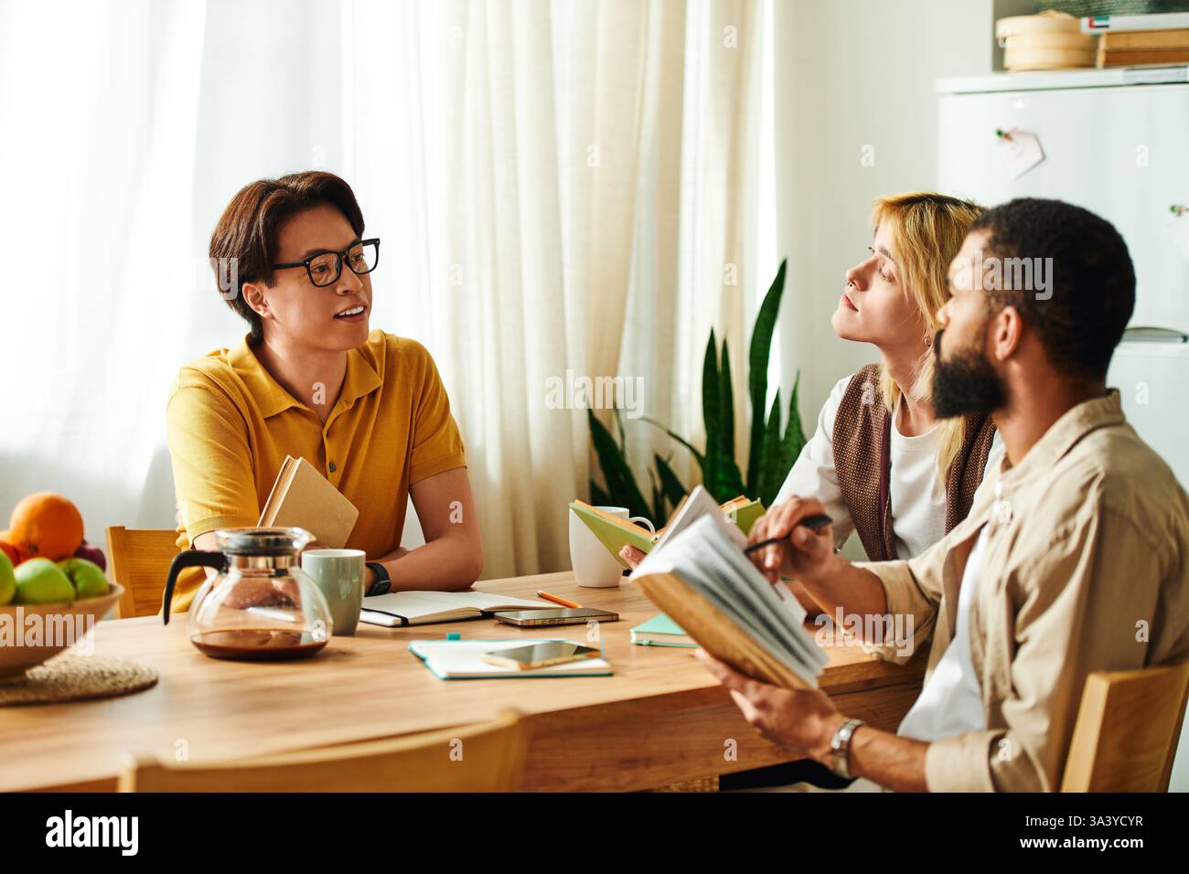 Young men share ideas and insights during a lively book club gathering ...