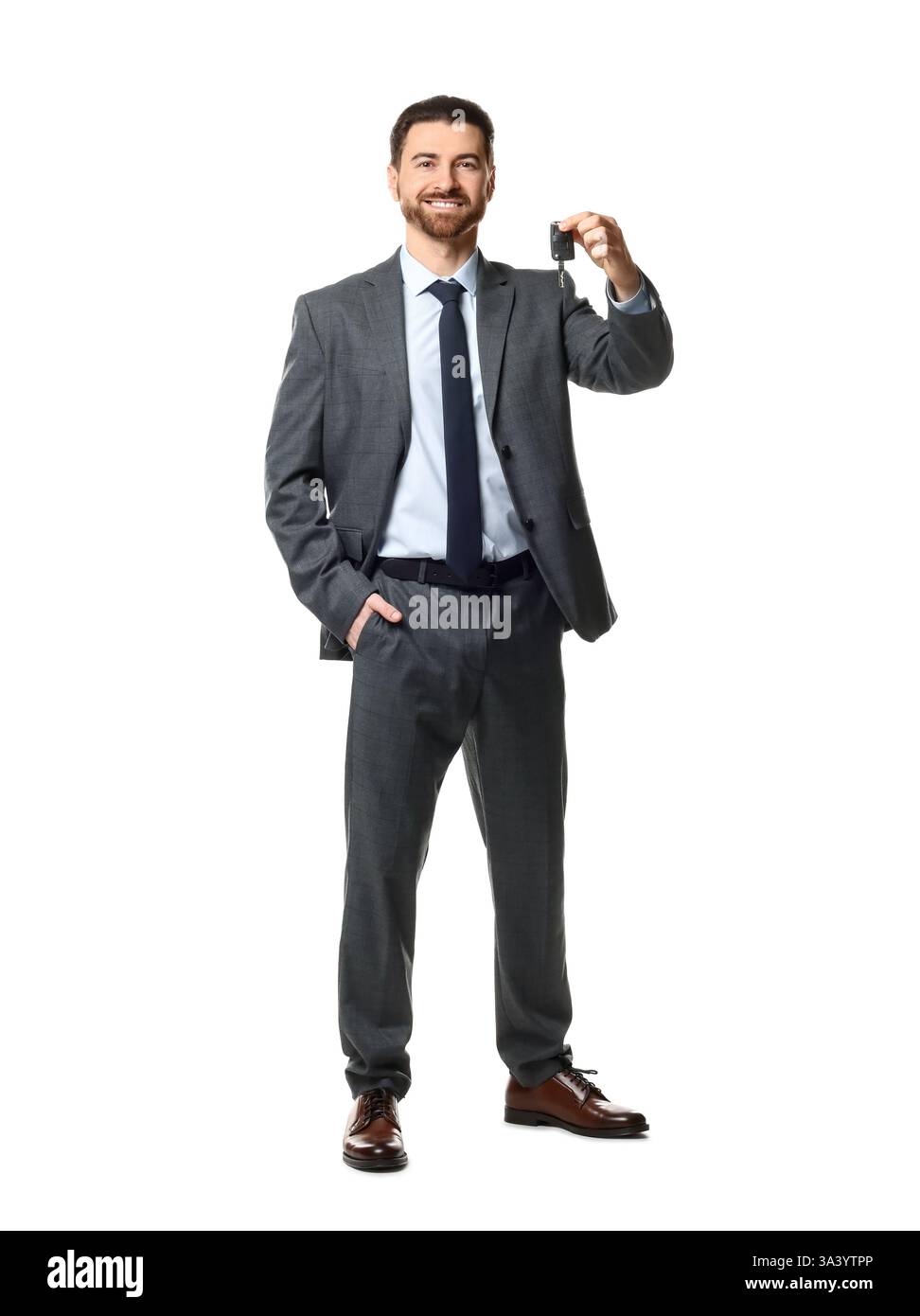 Cheerful salesman with car key on white background Stock Photo - Alamy