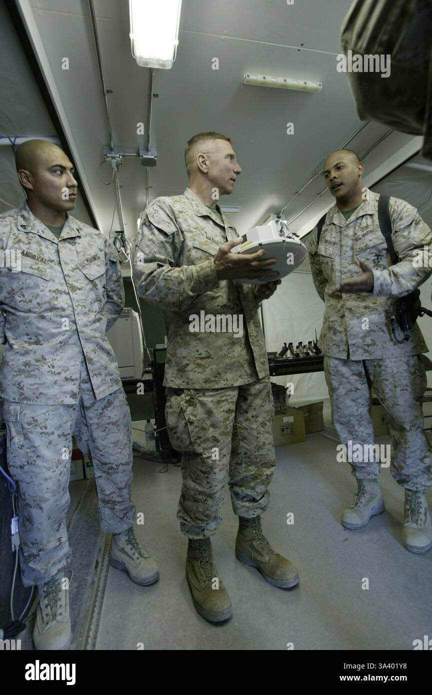 Apr 07, 2004; Camp Taqaddum, Iraq; Cpl. JUAN J. SANDOVAL, left and Capt ...