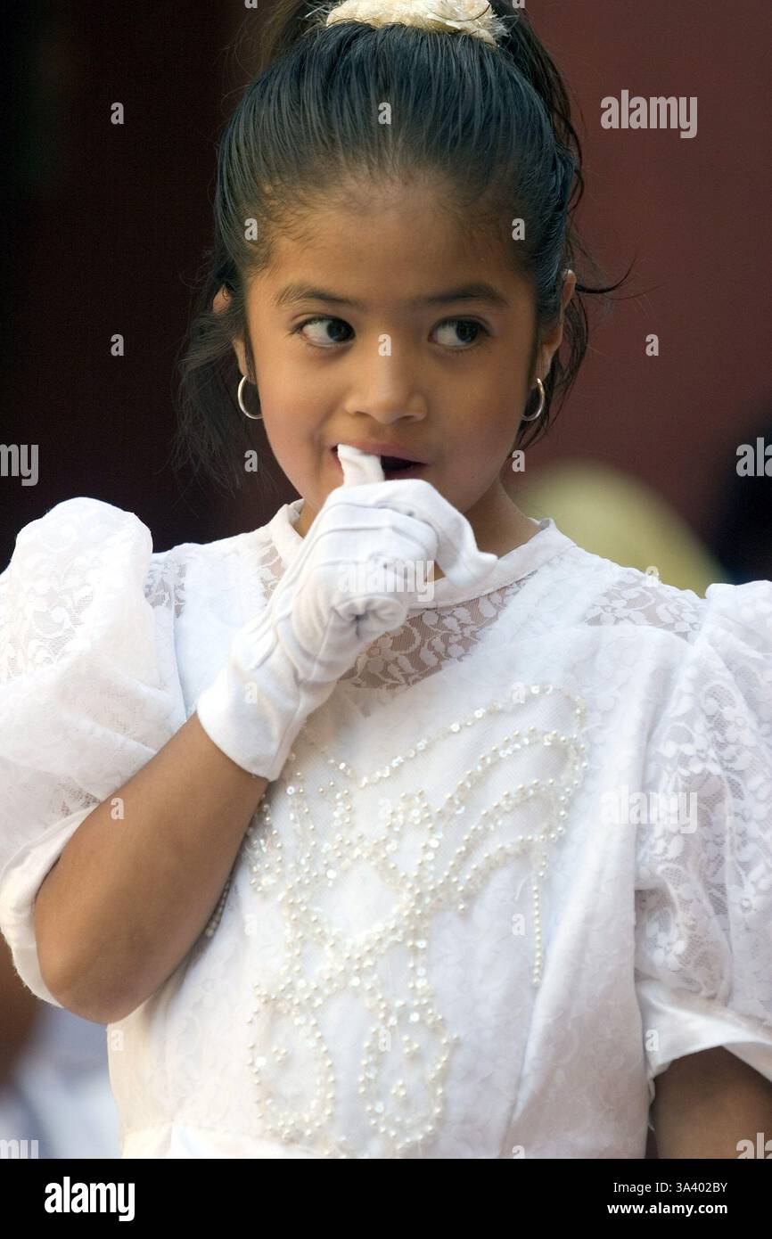 Apr 09, 2004; San Miguel, MEXICO; A girl in her first communion dress ...