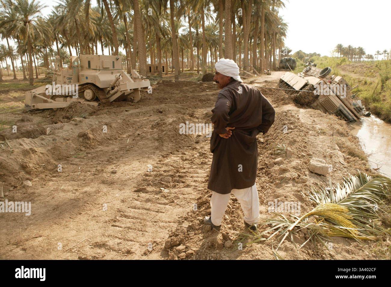 Apr 10, 2004; Fallujah, Iraq; An Iraqi farmer assesses the damage done ...