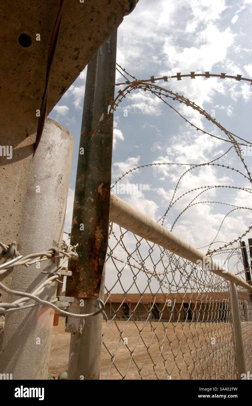 Apr 11, 2004; Camp Ar Ramadi, Iraq; Layers of razor-sharp wire provide ...