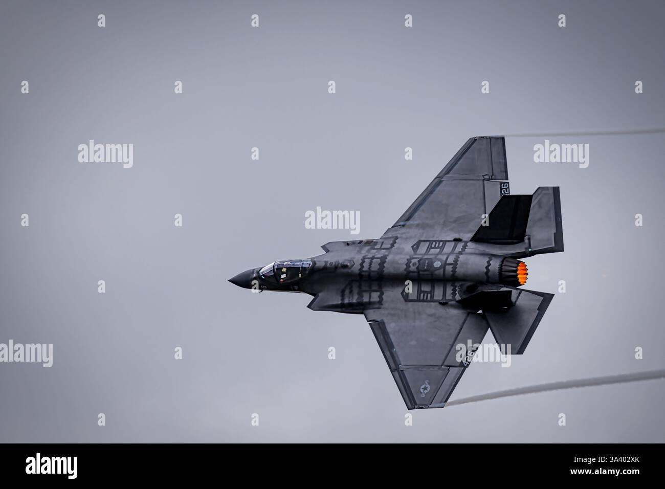 An F-35 Lightning II with vapor trails off the wings at the 2024 NAS ...