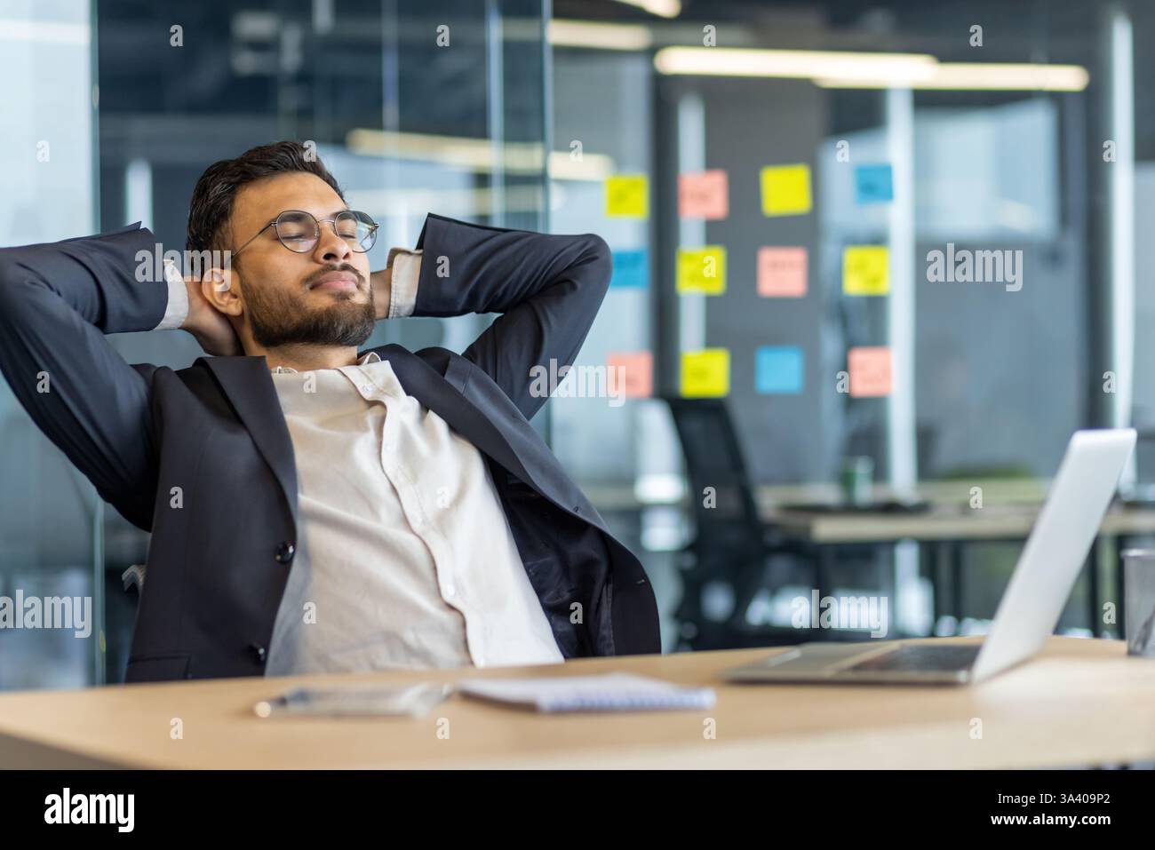 Businessman relaxing and resting inside the office. Man in business ...
