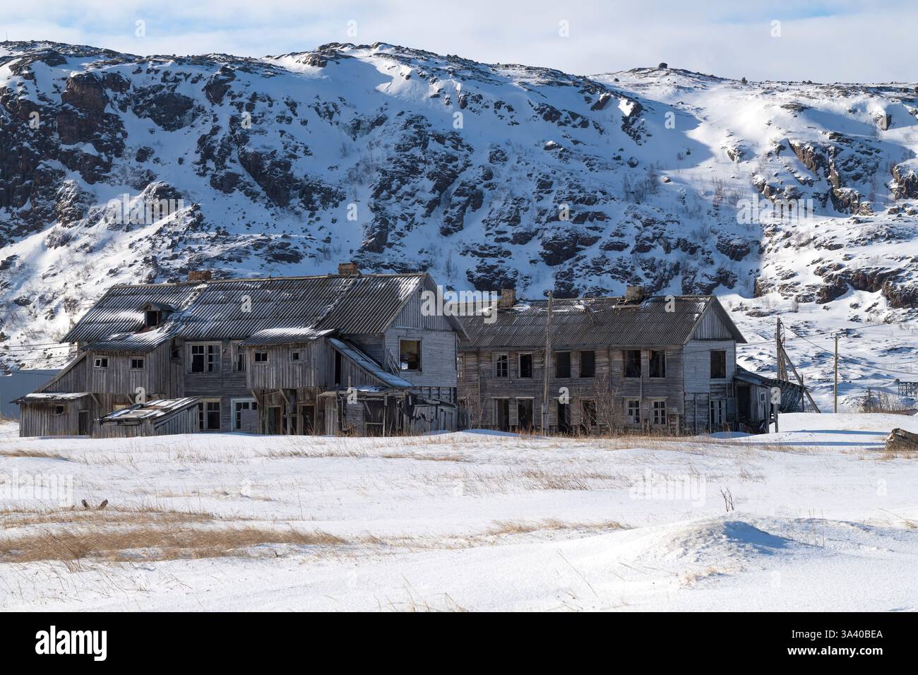 Old abandoned houses in the Arctic village of Teriberka on a sunny ...