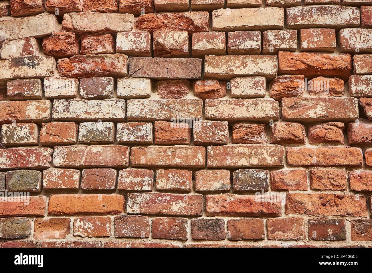 Old red brick wall background, uneven brickwork Stock Photo - Alamy