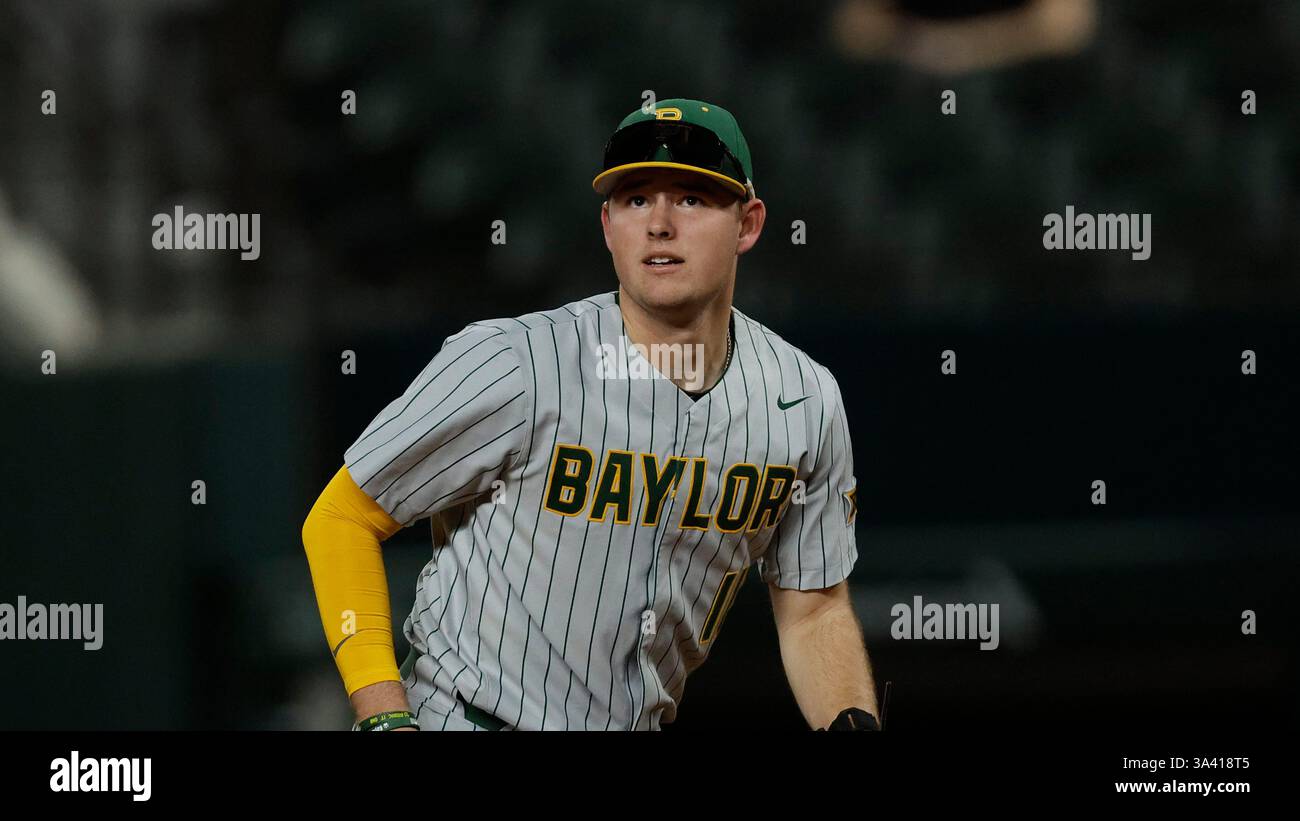 Baylor infielder Will Pendergrass runs back to first to catch the throw ...